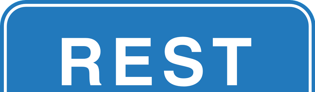 Top of a 'REST AREA' sign • Evolvable MeEvolvable Me